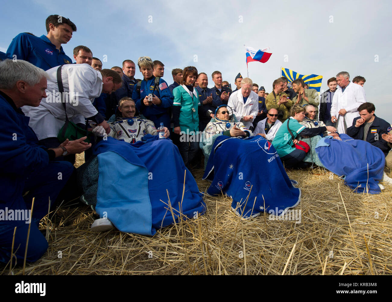 Expedition 30 Commander Dan Burbank, left, Flight Engineers Anton ...