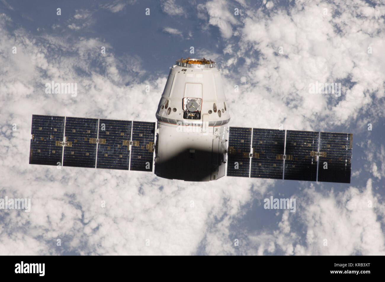 SpaceX Dragon C2 approaching ISS Stock Photo - Alamy
