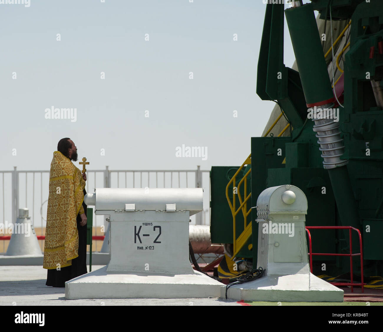 An Orthodox priest blesses the Soyuz rocket at the Baikonur Cosmodrome ...