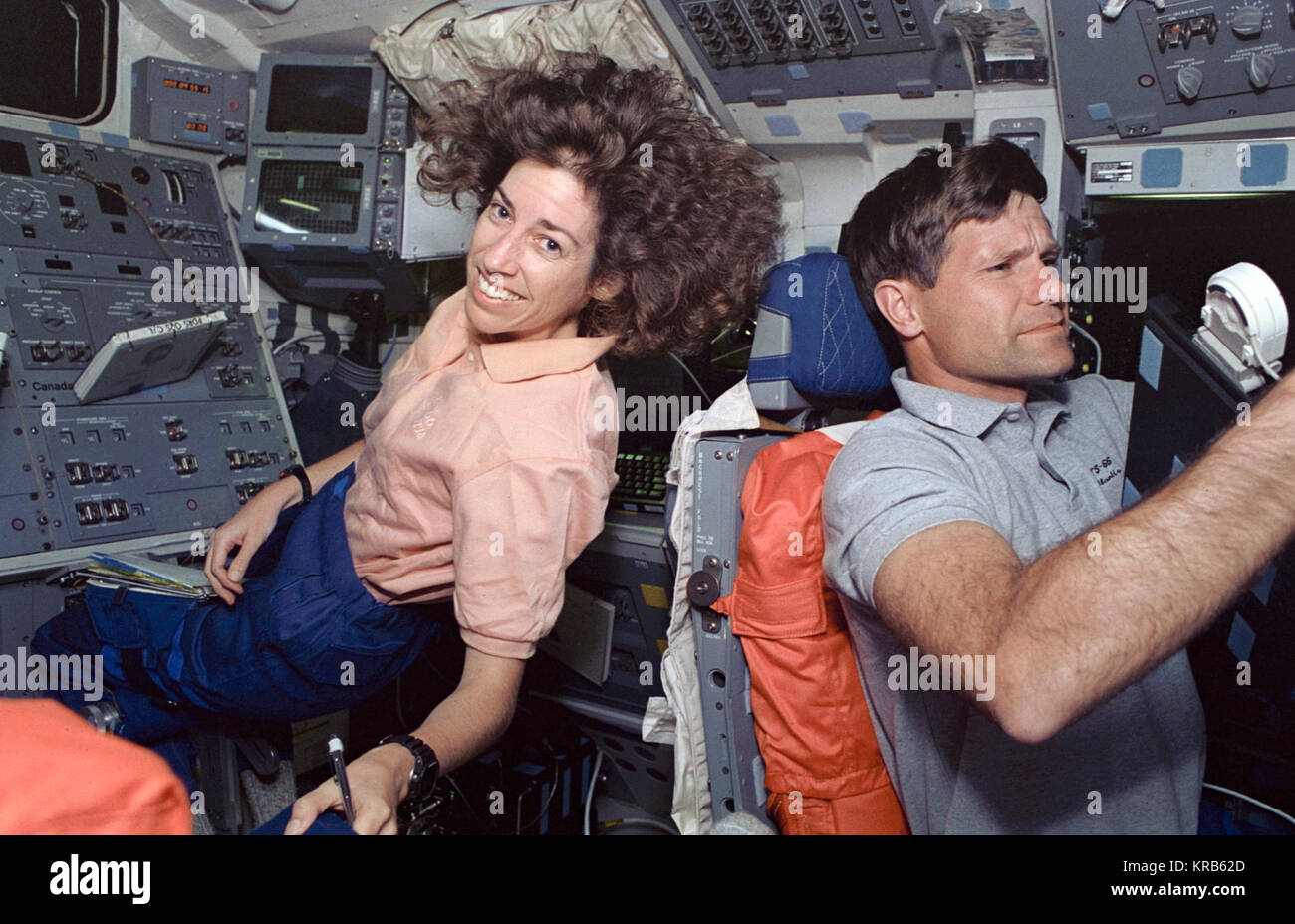 Payload Commander Ellen Ochoa and Commander Donald McMonagle attend to tasks on the Space ...