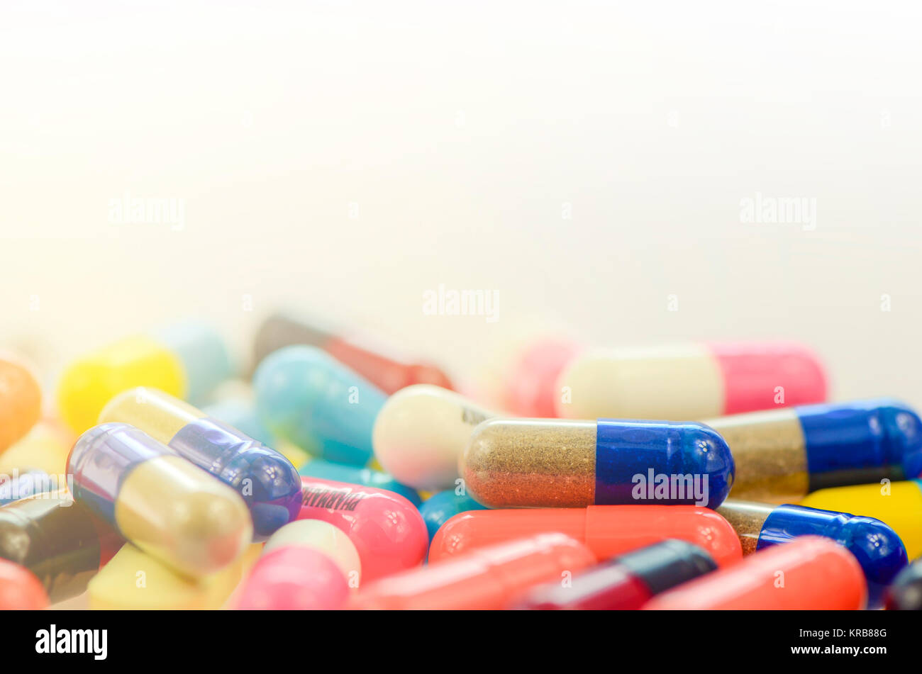 Oral medication background with warm light.Colorful of oral medications ...