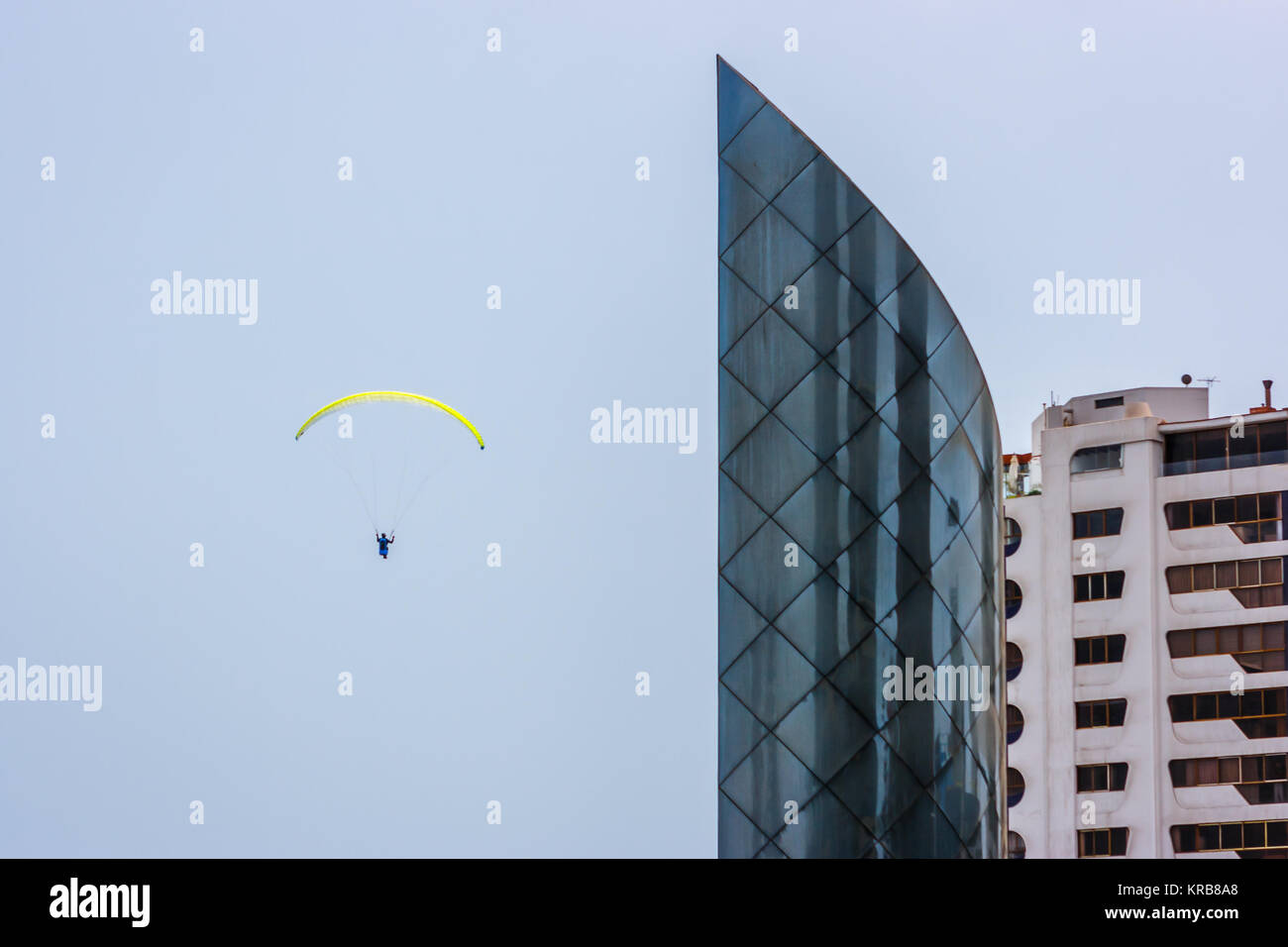 Yellow paraglider flying over Lima, Peru Stock Photo - Alamy