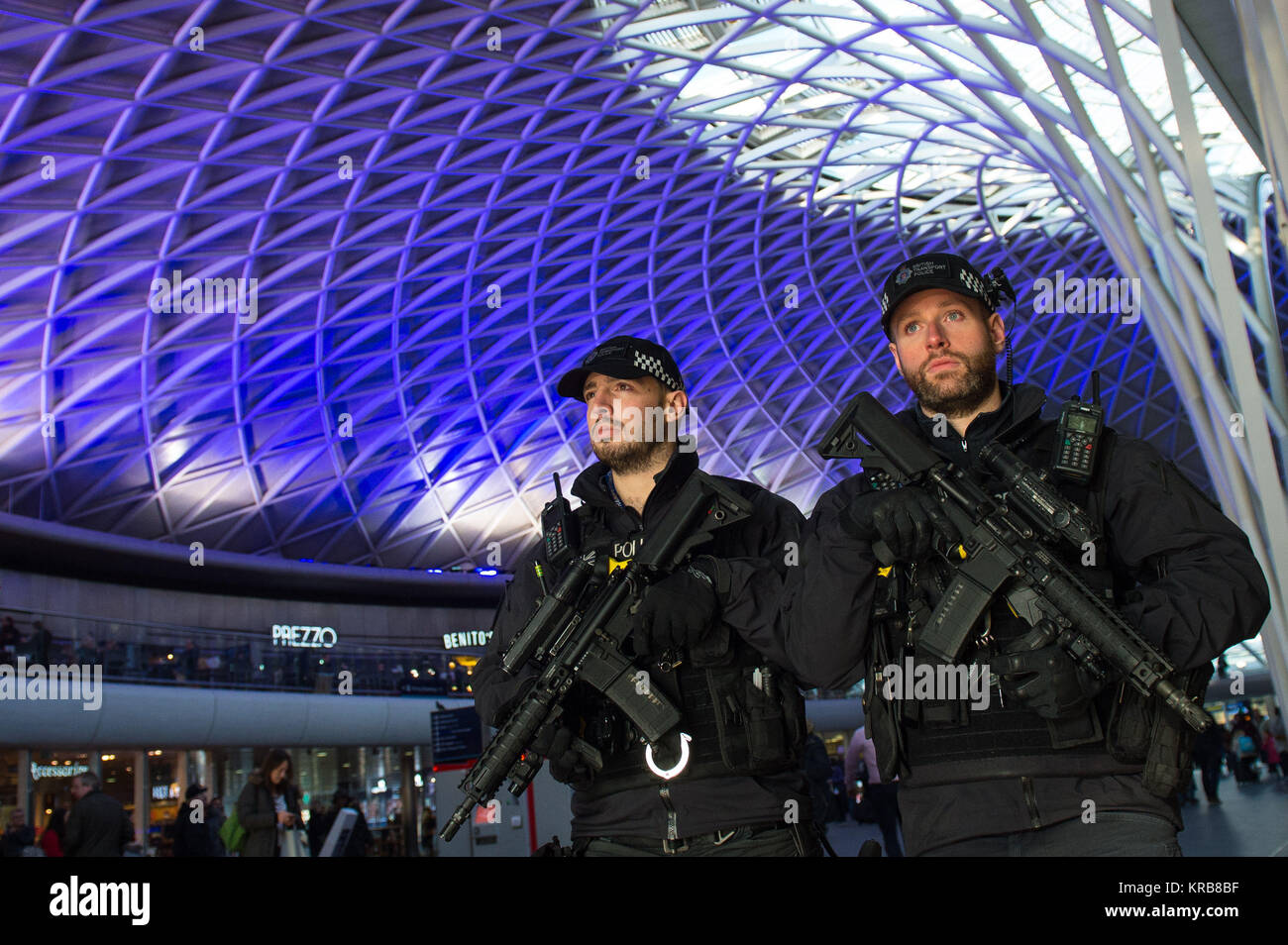 Armed British Transport Police officers on patrol at Kings Cross ...