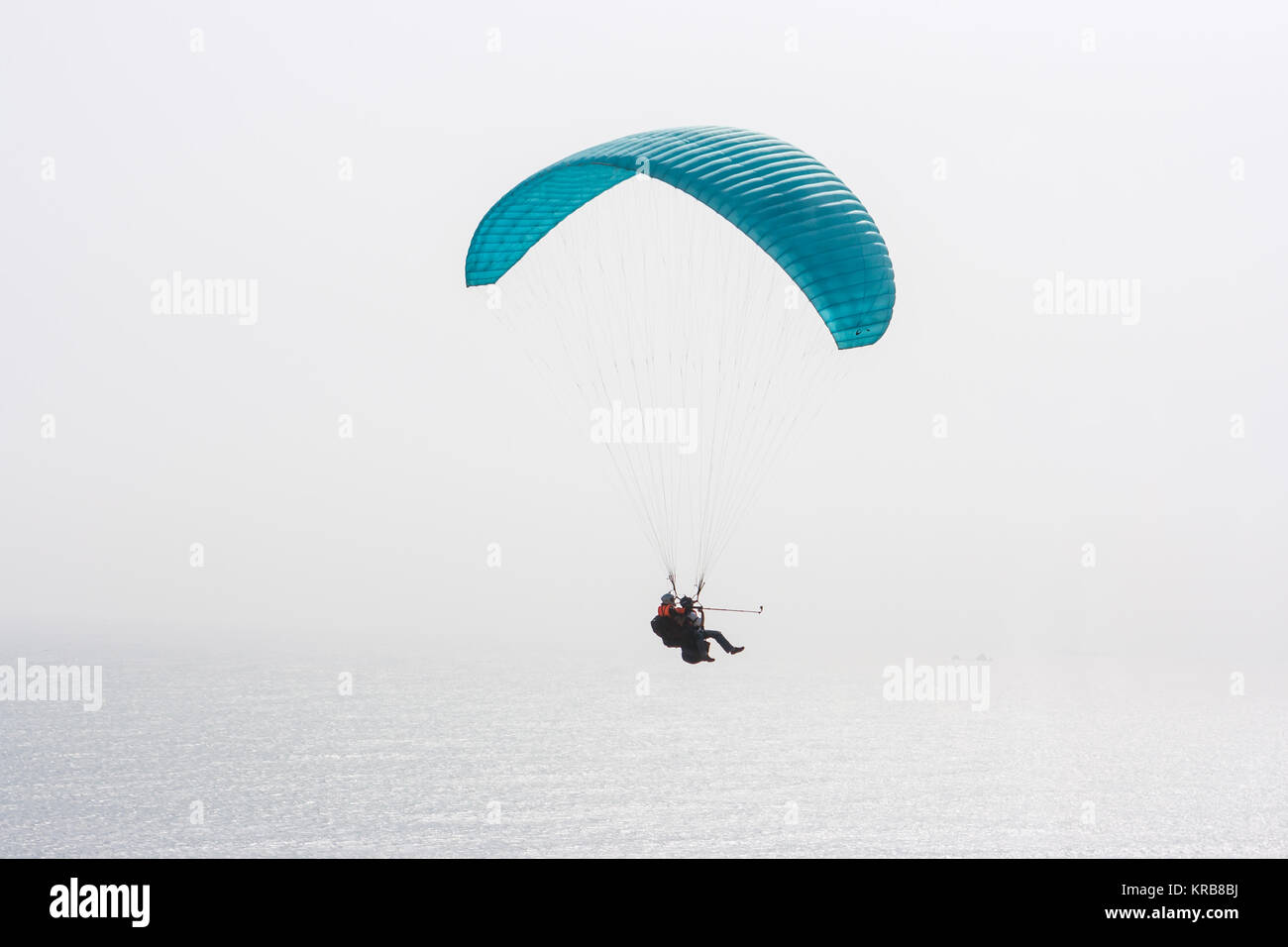 Blue paraglider flying over Lima, Peru Stock Photo - Alamy