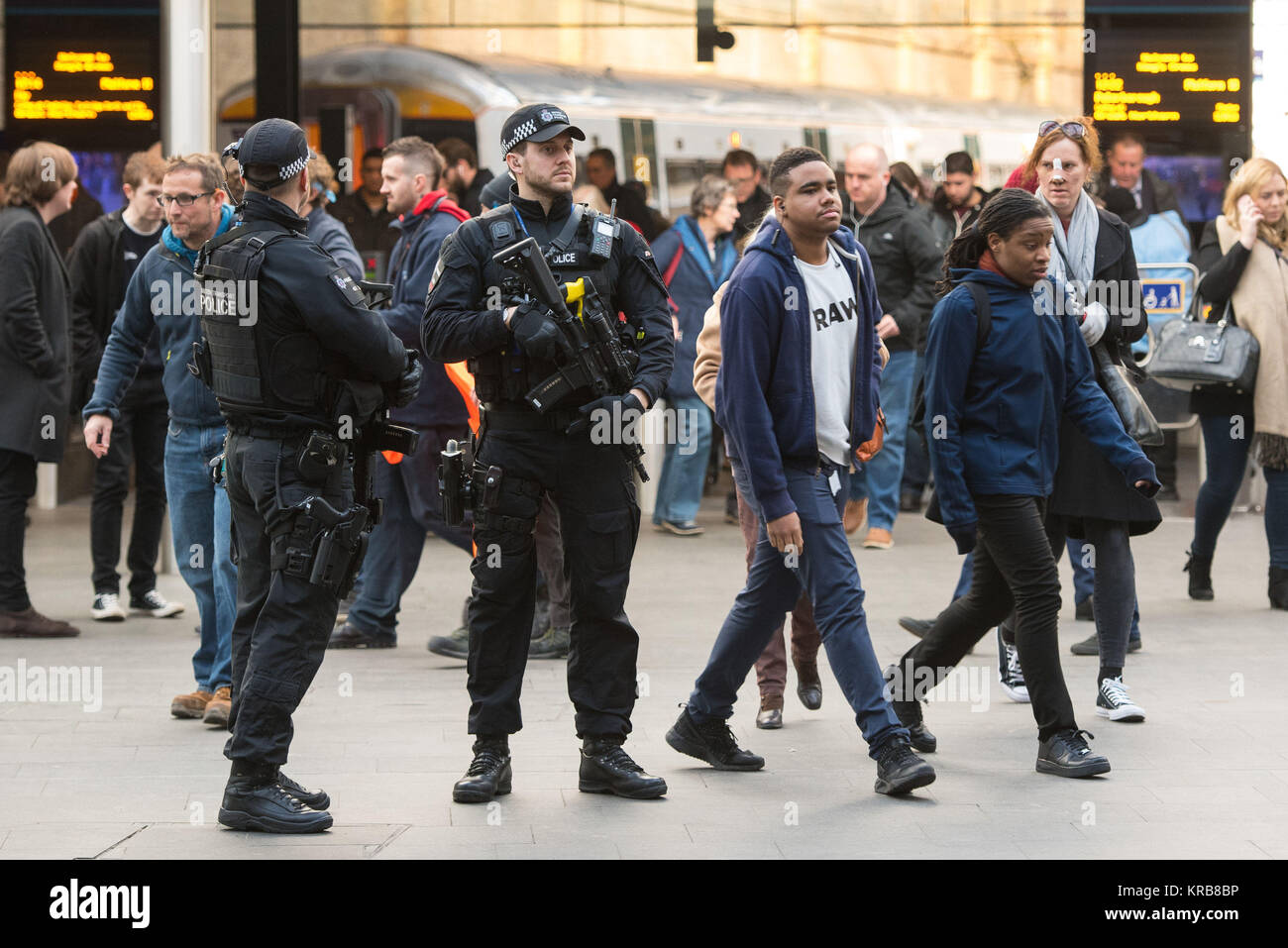 Armed British transport Police officers on patrol at Kings Cross ...