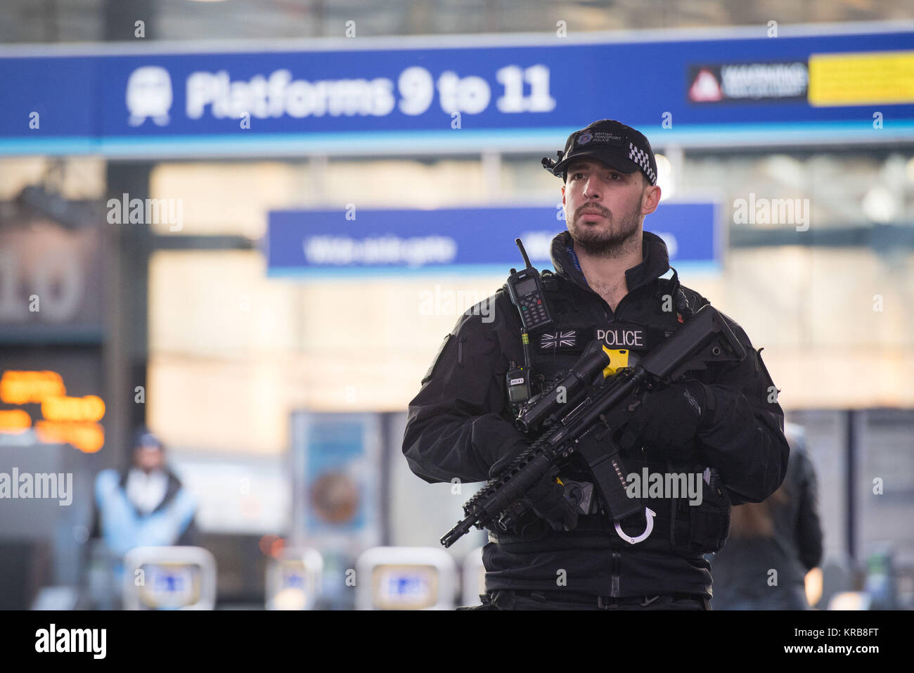 Armed British transport Police officers on patrol at Kings Cross ...
