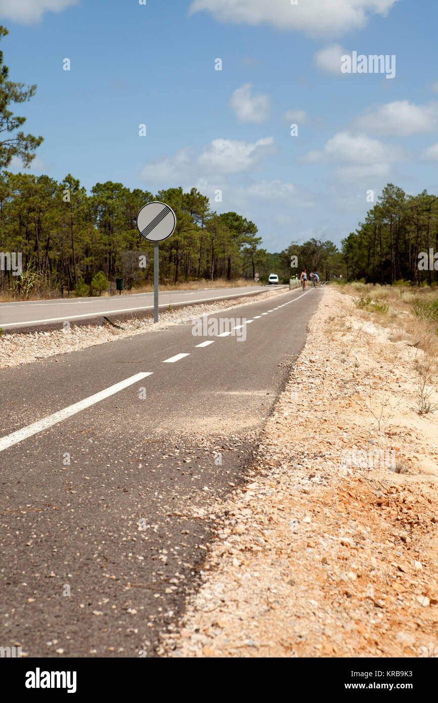 Cycle path near Marinha Grande, Portugal. The tarmac track runs ...