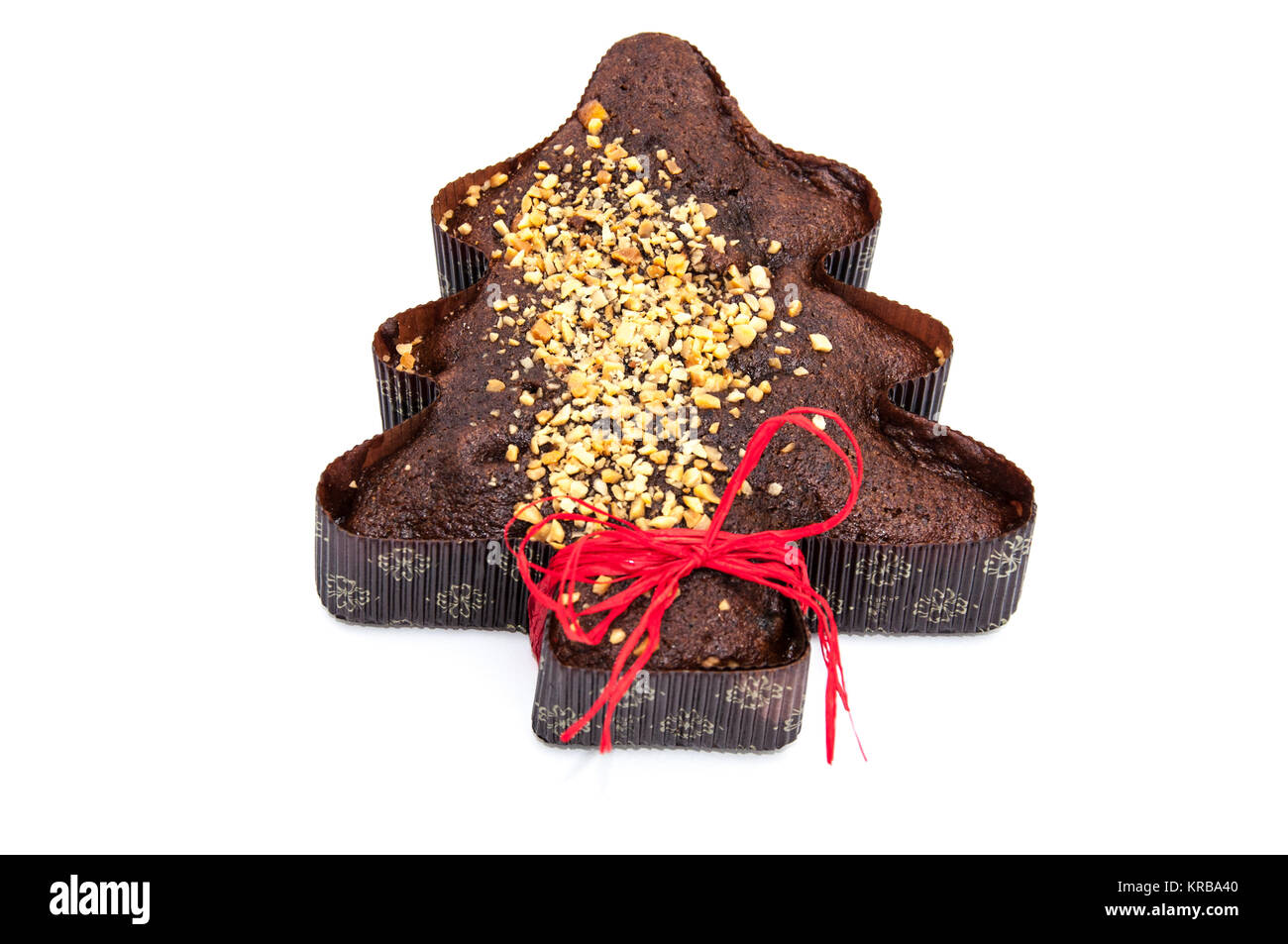Red stripe on the gingerbread tree with nuts on the white background ...