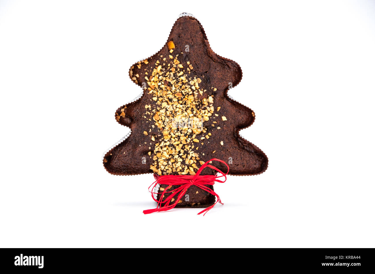 Red stripe on the gingerbread tree with nuts on the white background ...
