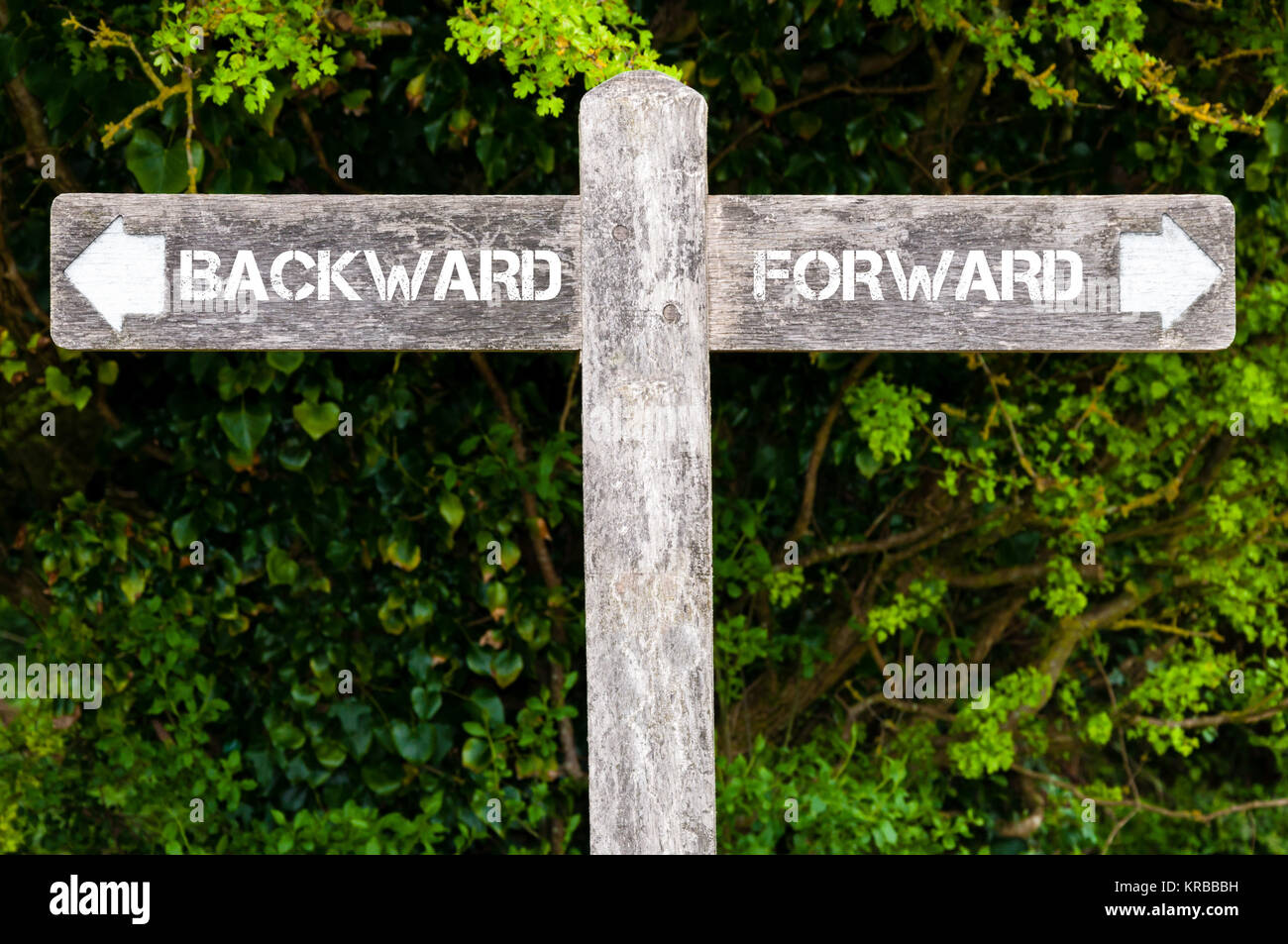 BACKWARD versus FORWARD directional signs Stock Photo - Alamy