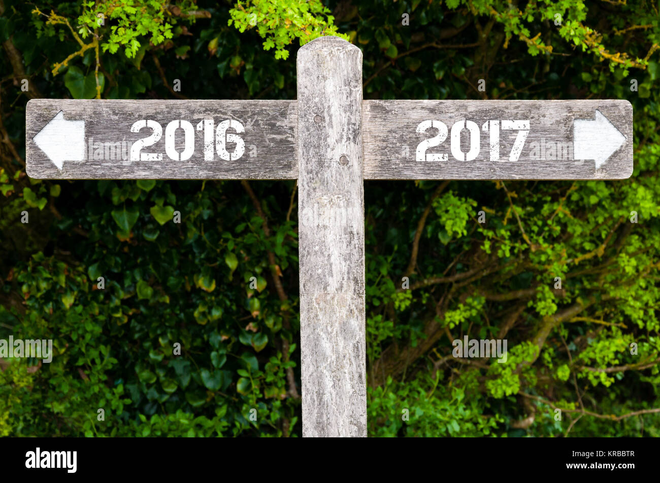 Year 2016 versus 2017 directional signs Stock Photo - Alamy