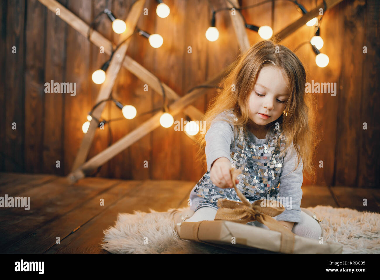 litle girl opening presents Stock Photo - Alamy