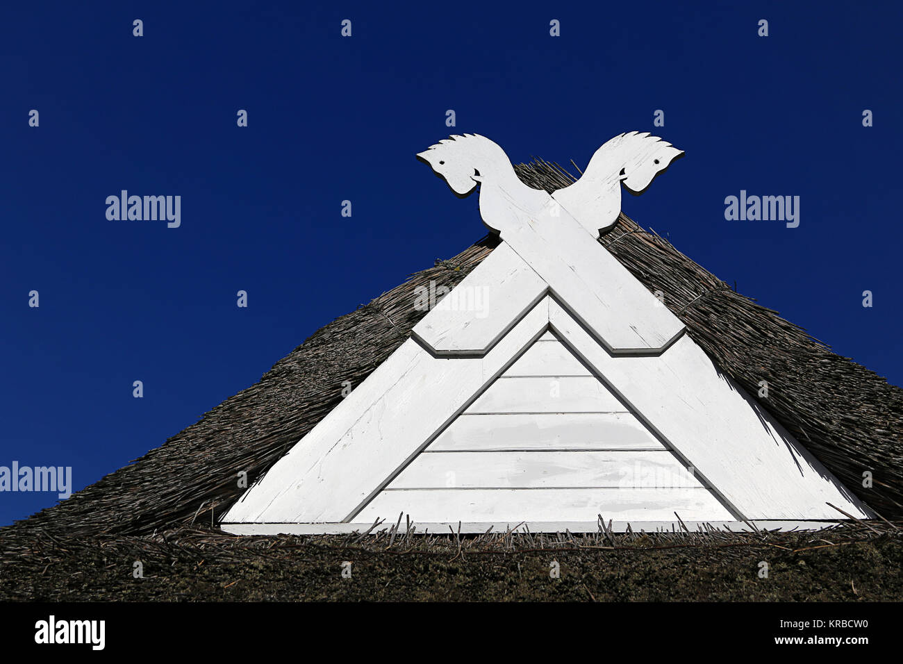 horse heads on low german hall house Stock Photo - Alamy