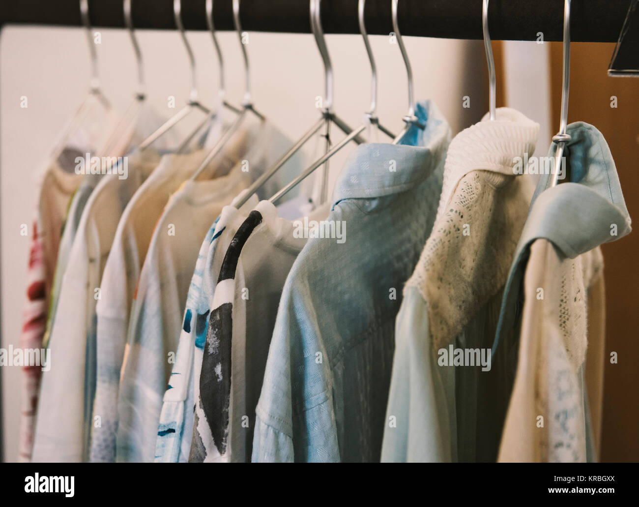 Clothes on hangers hi-res stock photography and images - Alamy