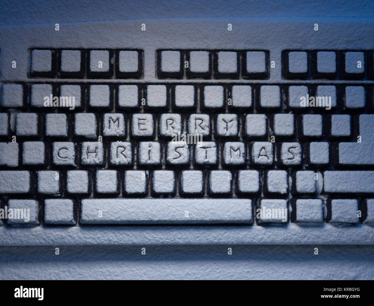 computer keyboard with text merry christmas on buttons covered with ...