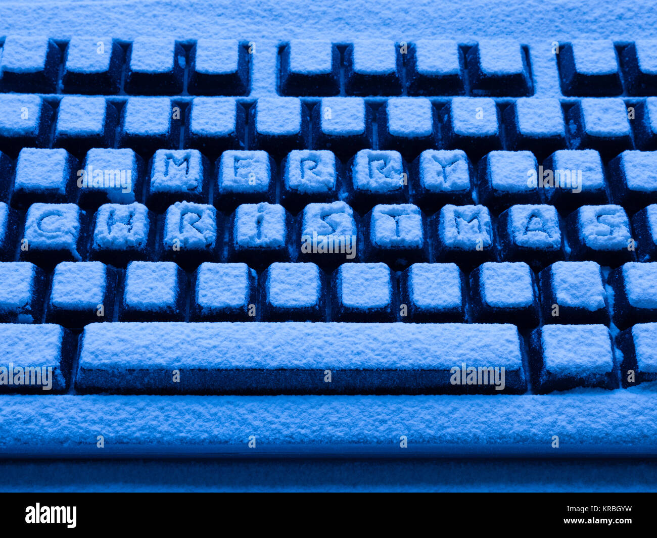 computer keyboard with text merry christmas on buttons covered with ...