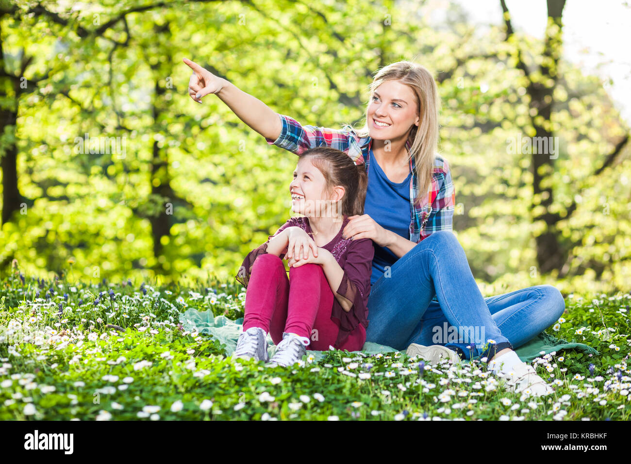 Two sisters having fun in park Stock Photo - Alamy