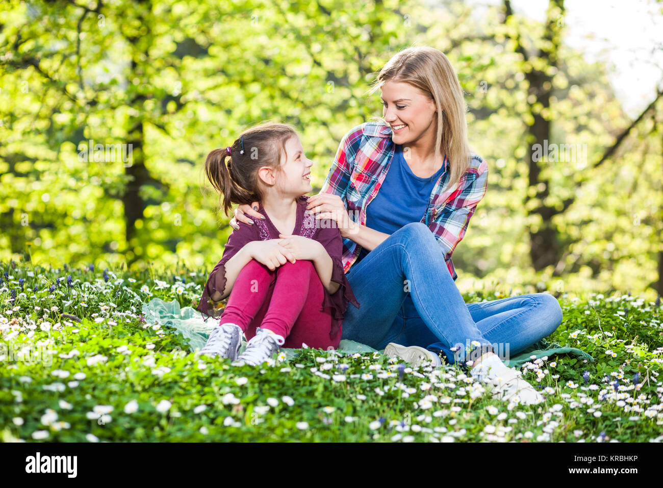 Two sisters having fun in park Stock Photo - Alamy