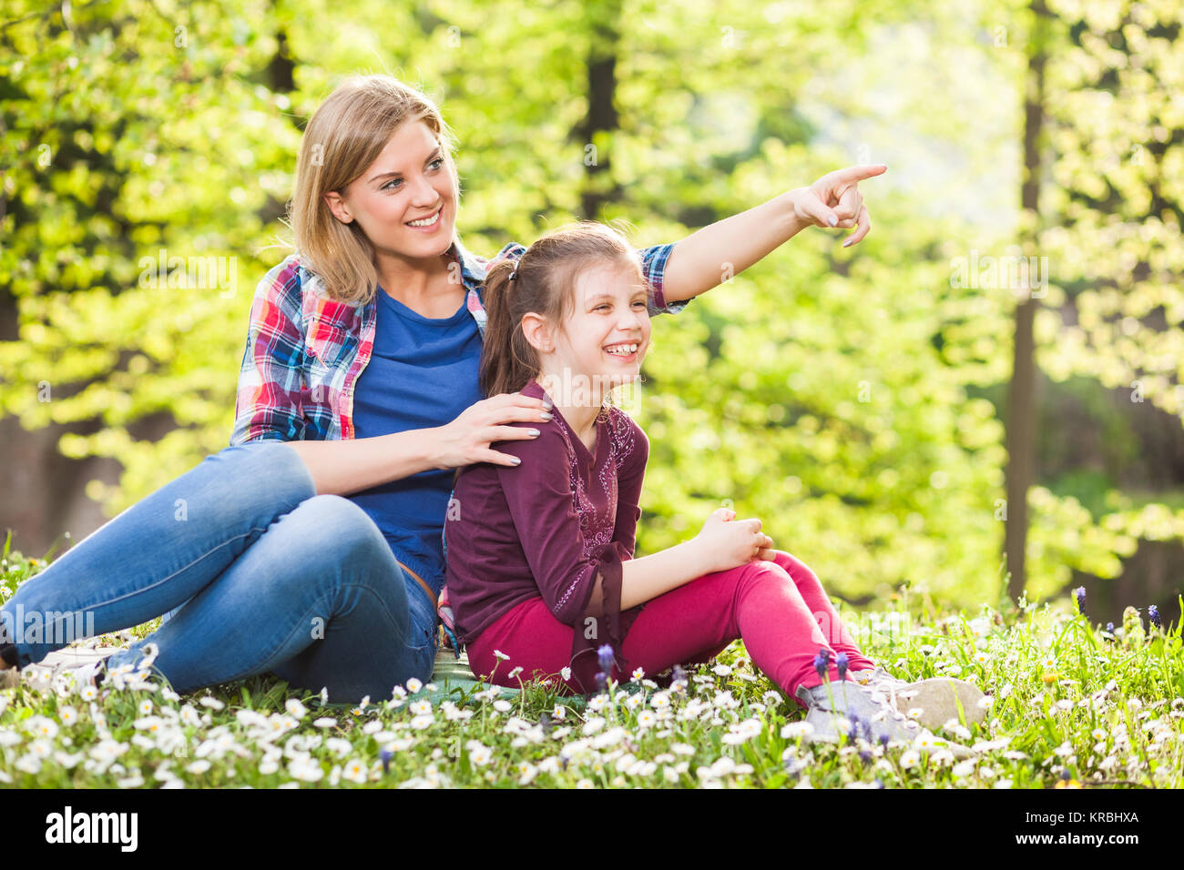 Two sisters having fun in park Stock Photo - Alamy