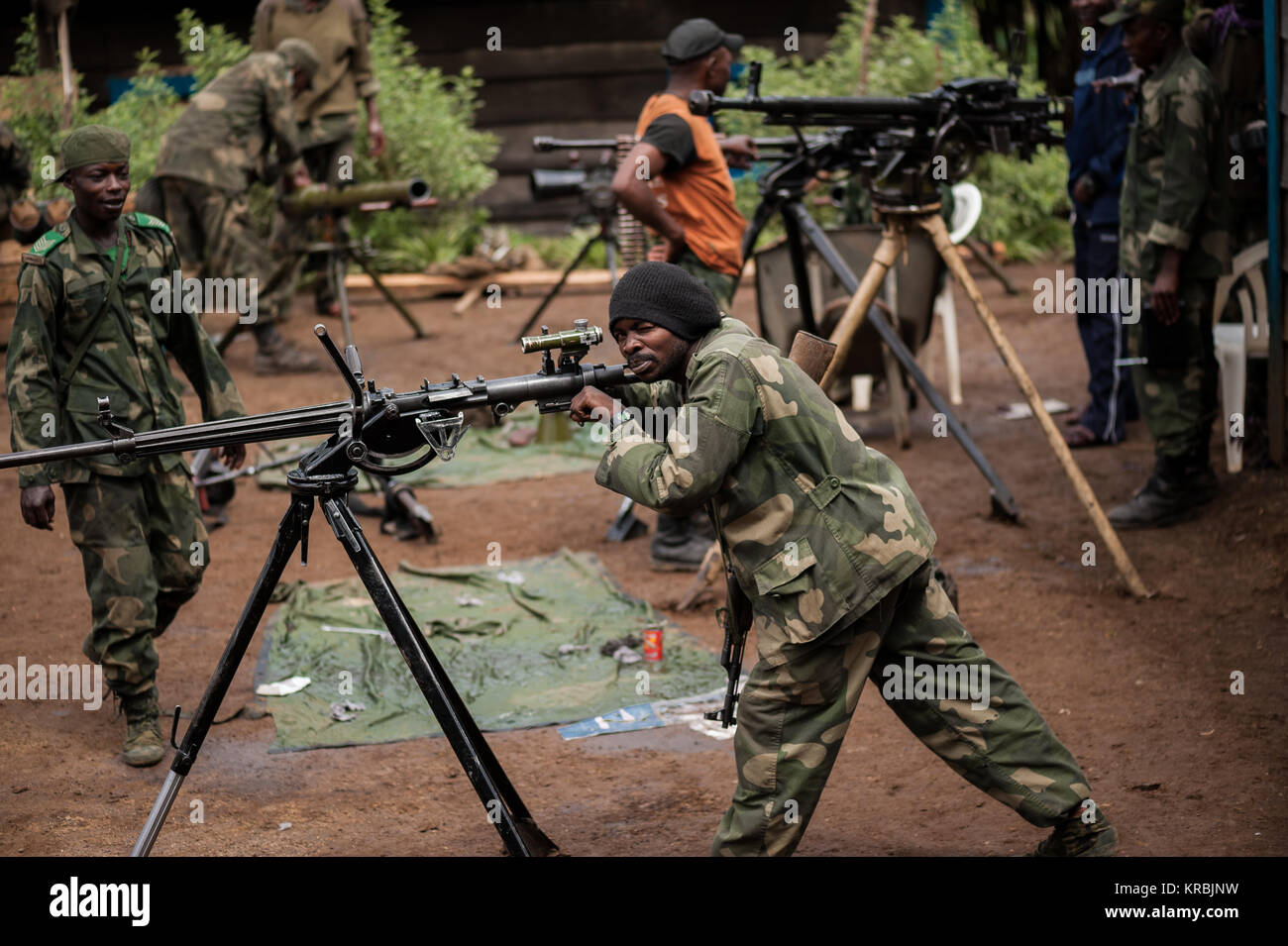 FARDC soldiers cleaning and checking weapons in the DRC's Virunga ...
