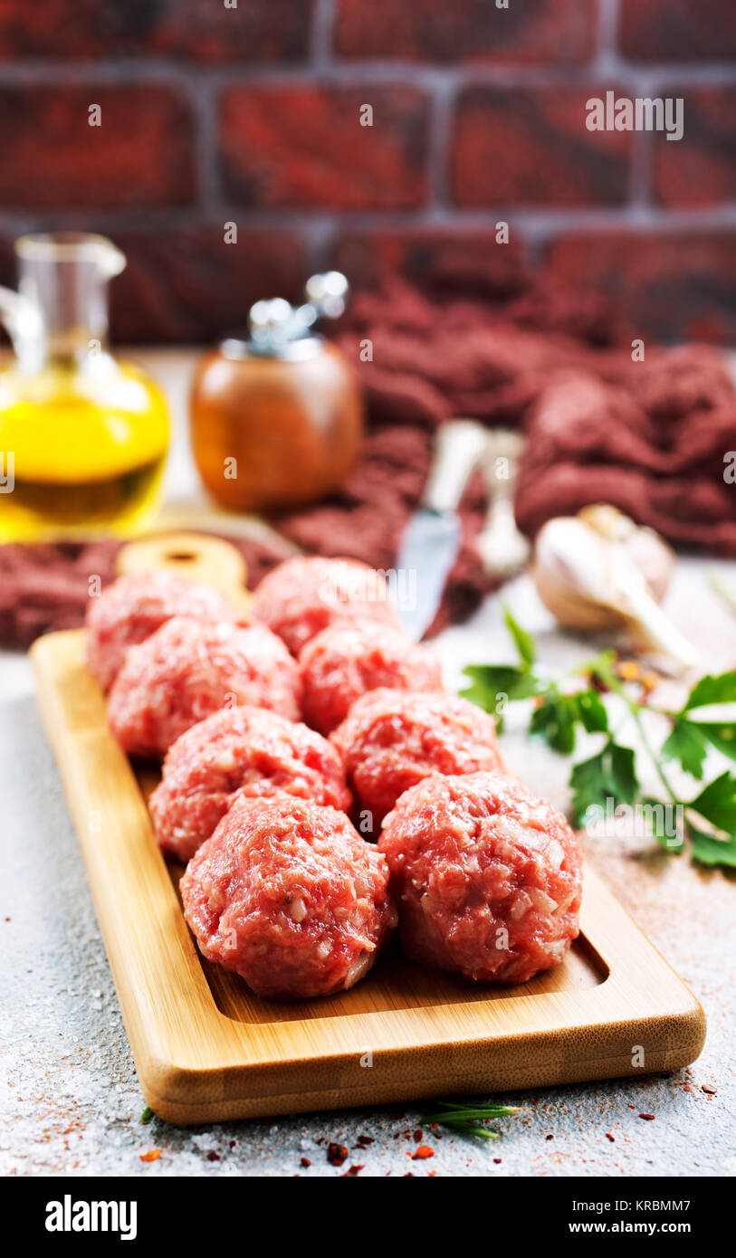 raw meatballs with aroma spice and on a table Stock Photo - Alamy