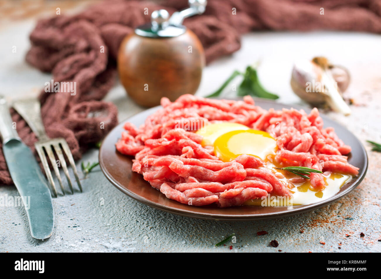 minced meat with raw egg and salt Stock Photo - Alamy