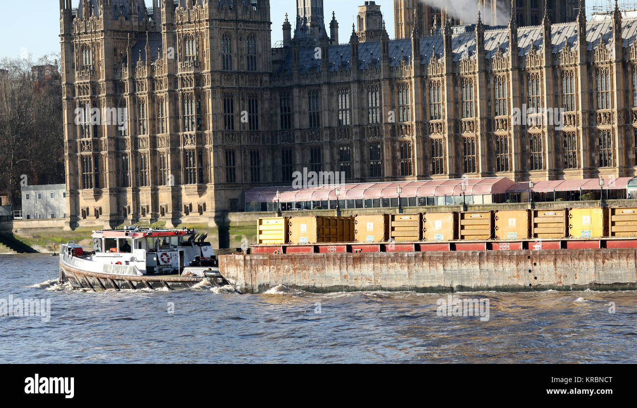 Parliament House of Commons with Cory waste going past in containers ...