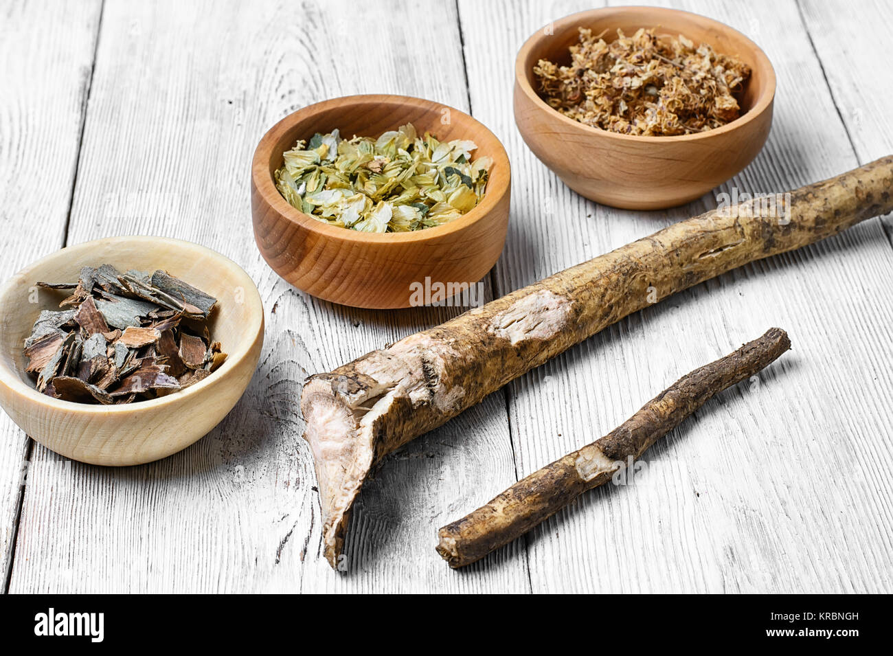 Medicinal plants,herbs in the wooden bowl and inula root Stock Photo ...
