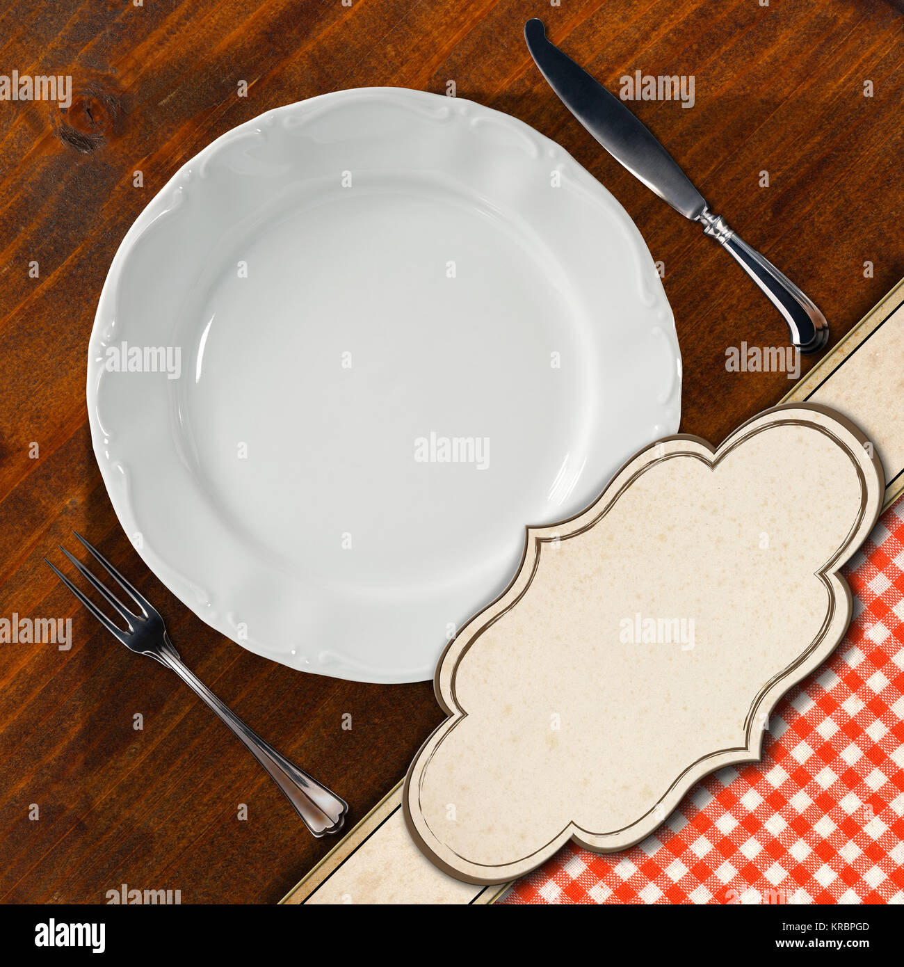 Restaurant menu with empty white plate with silver cutlery, on wooden ...