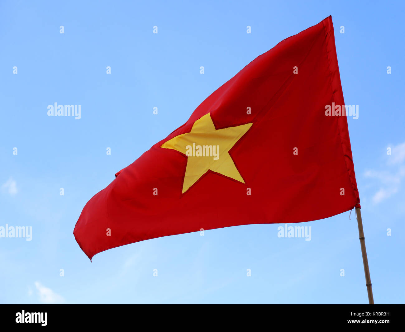 flag of Vietnam with yellow star in the red background with blue sky ...