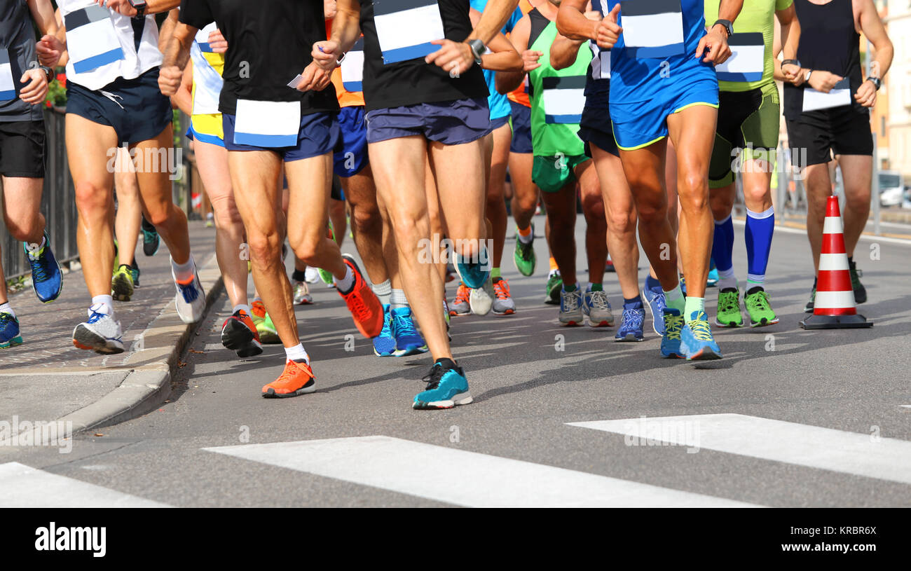 many fast runners run at finish line during race in the city Stock ...