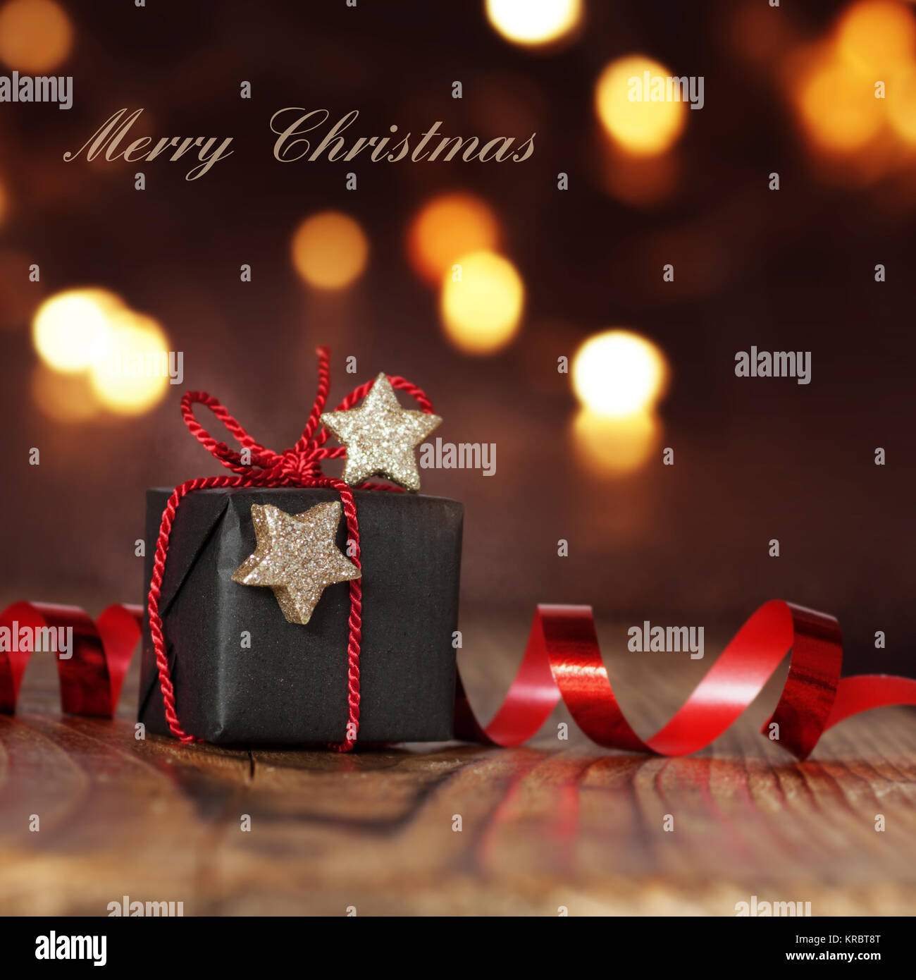 christmas package with red ribbon Stock Photo - Alamy