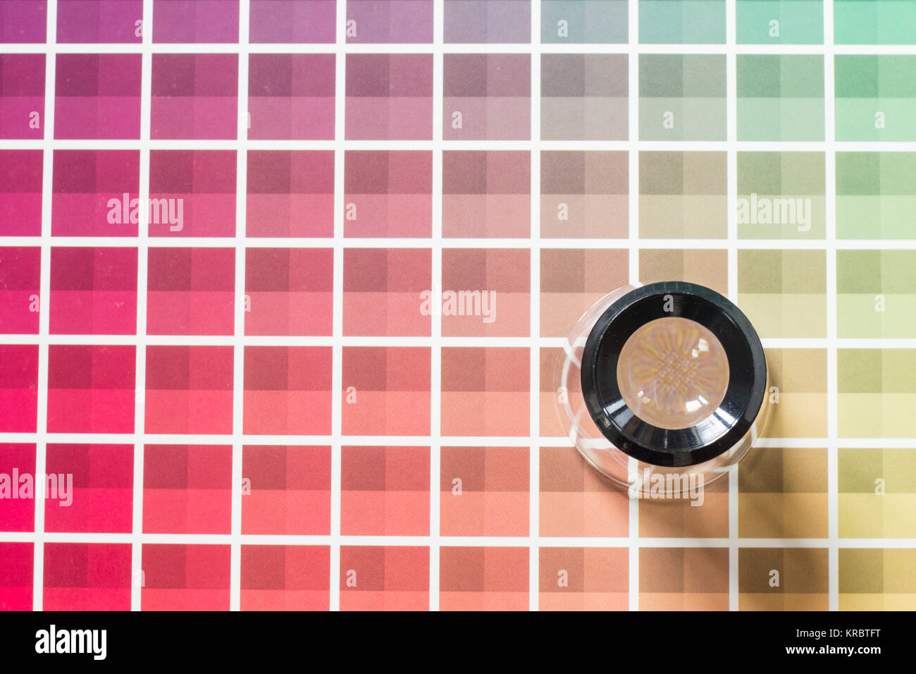 Magnifier on a color chart Stock Photo - Alamy