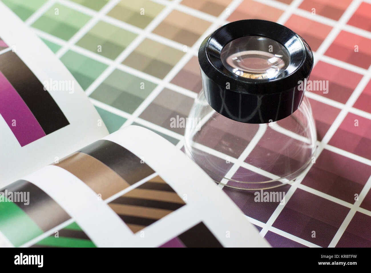 Magnifier on a color chart Stock Photo - Alamy