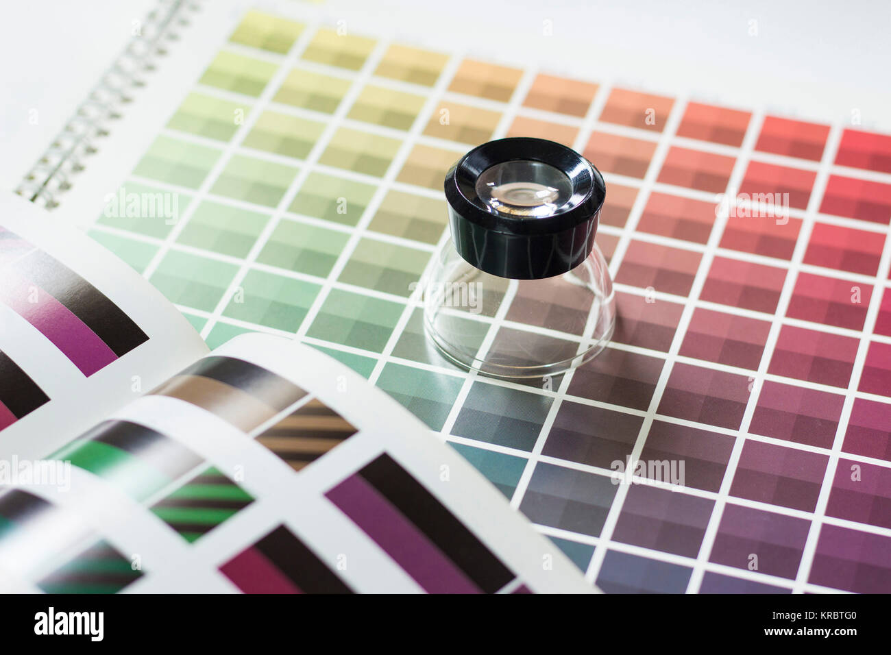 Magnifier on a color chart Stock Photo - Alamy