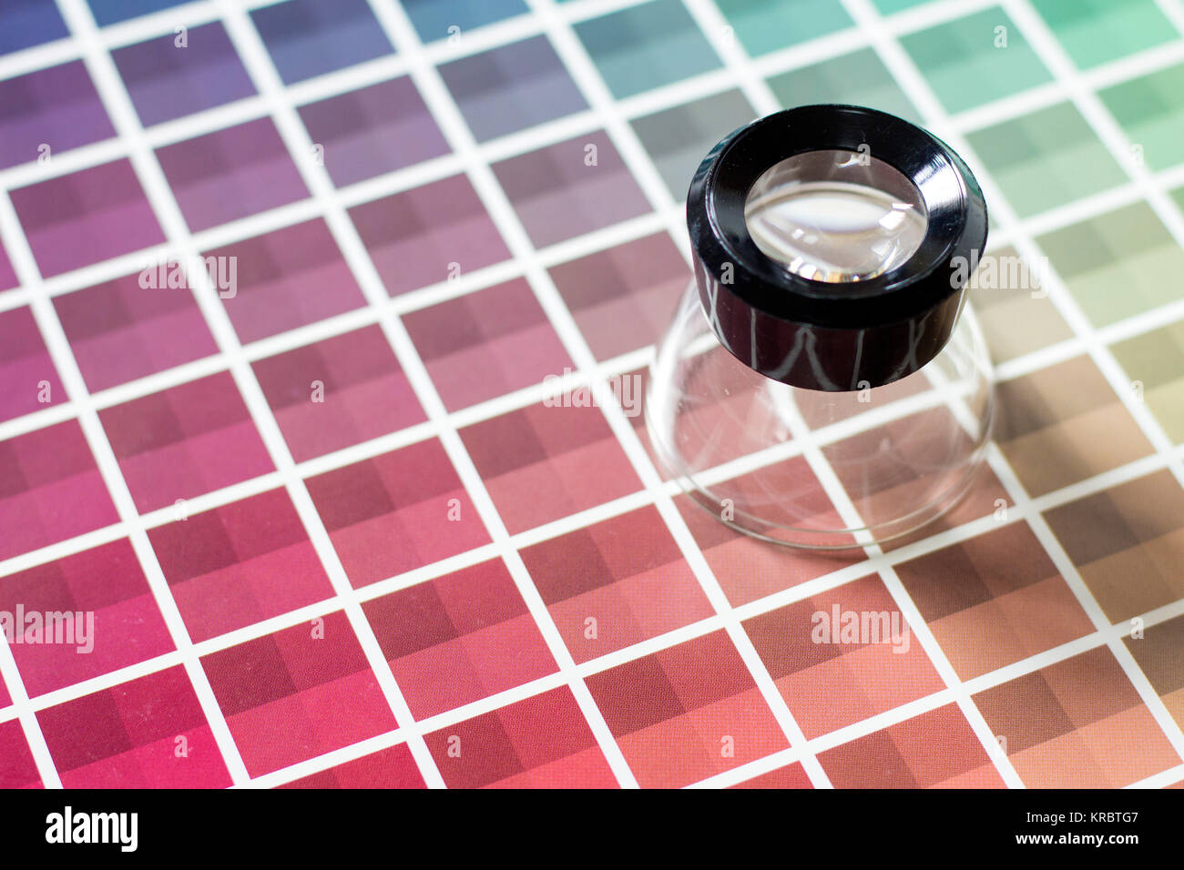 Magnifier on a color chart Stock Photo - Alamy