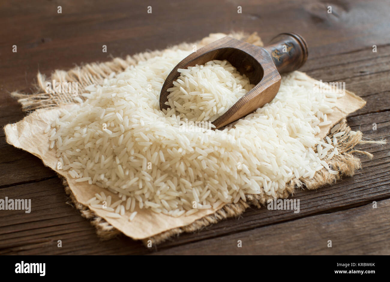 Pile of raw Basmati rice with a spoon Stock Photo - Alamy