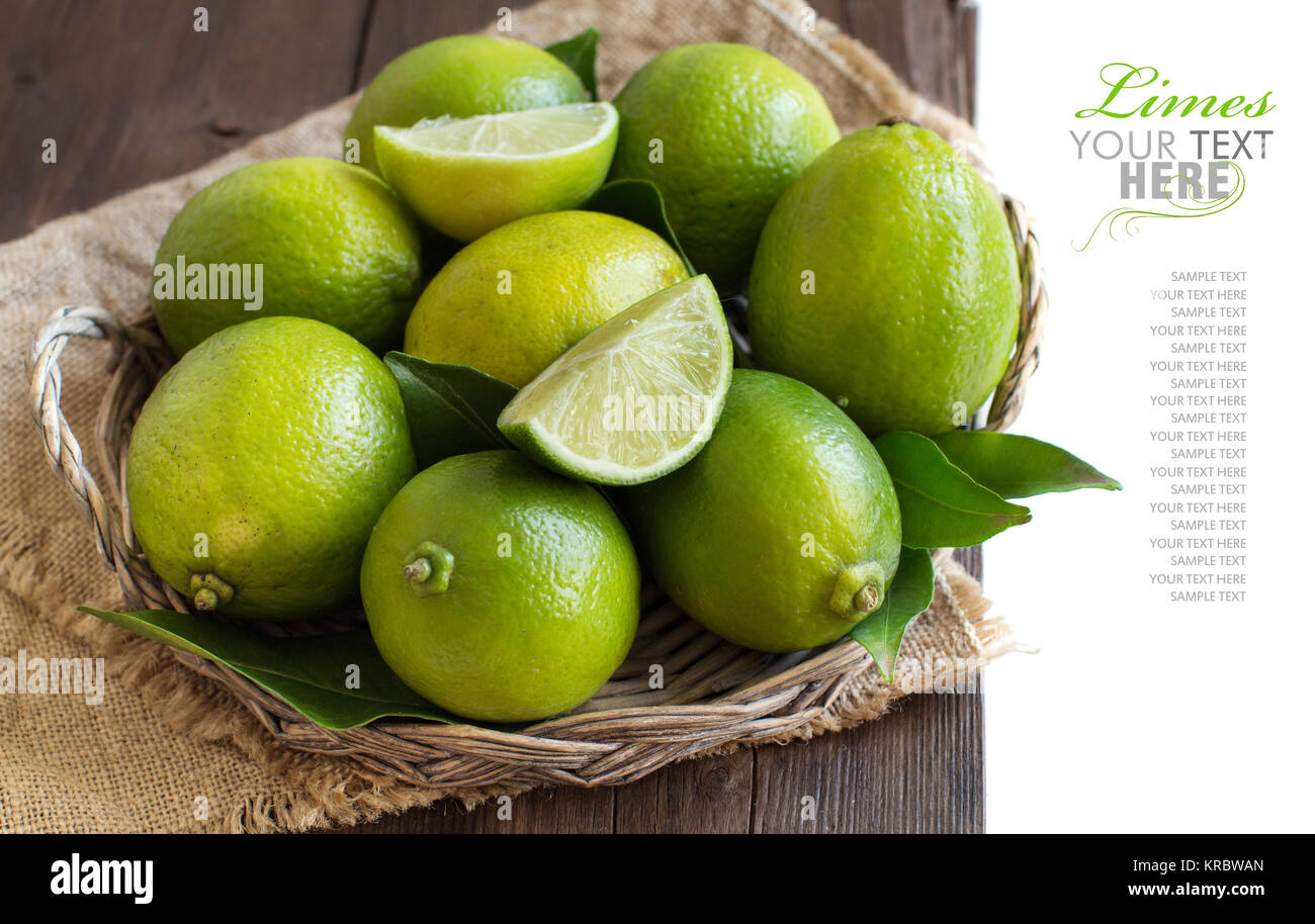 Fresh limes in a basket Stock Photo - Alamy