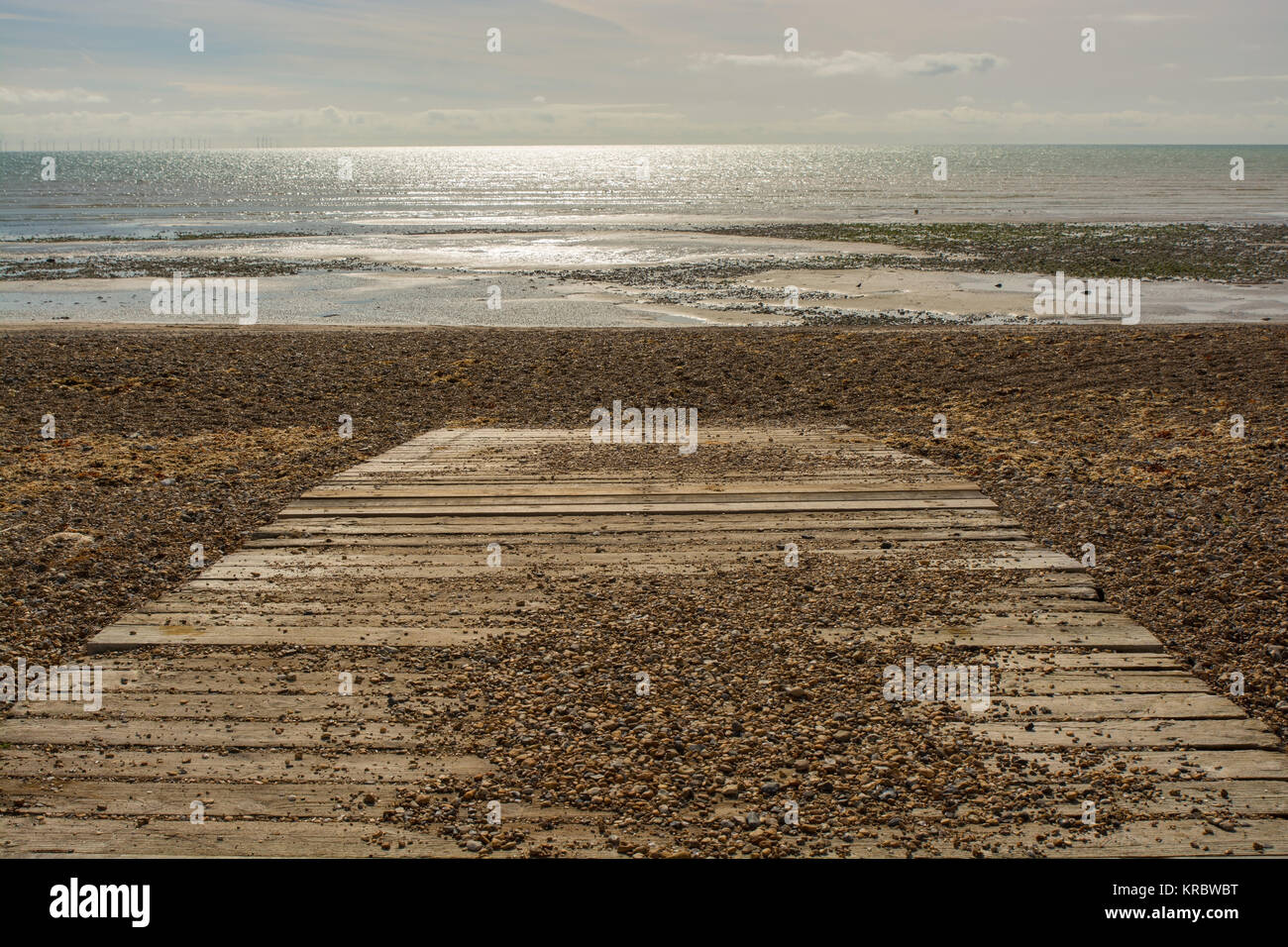Boarded ramp leading onto shingle beach at Goring in Worthing, West ...