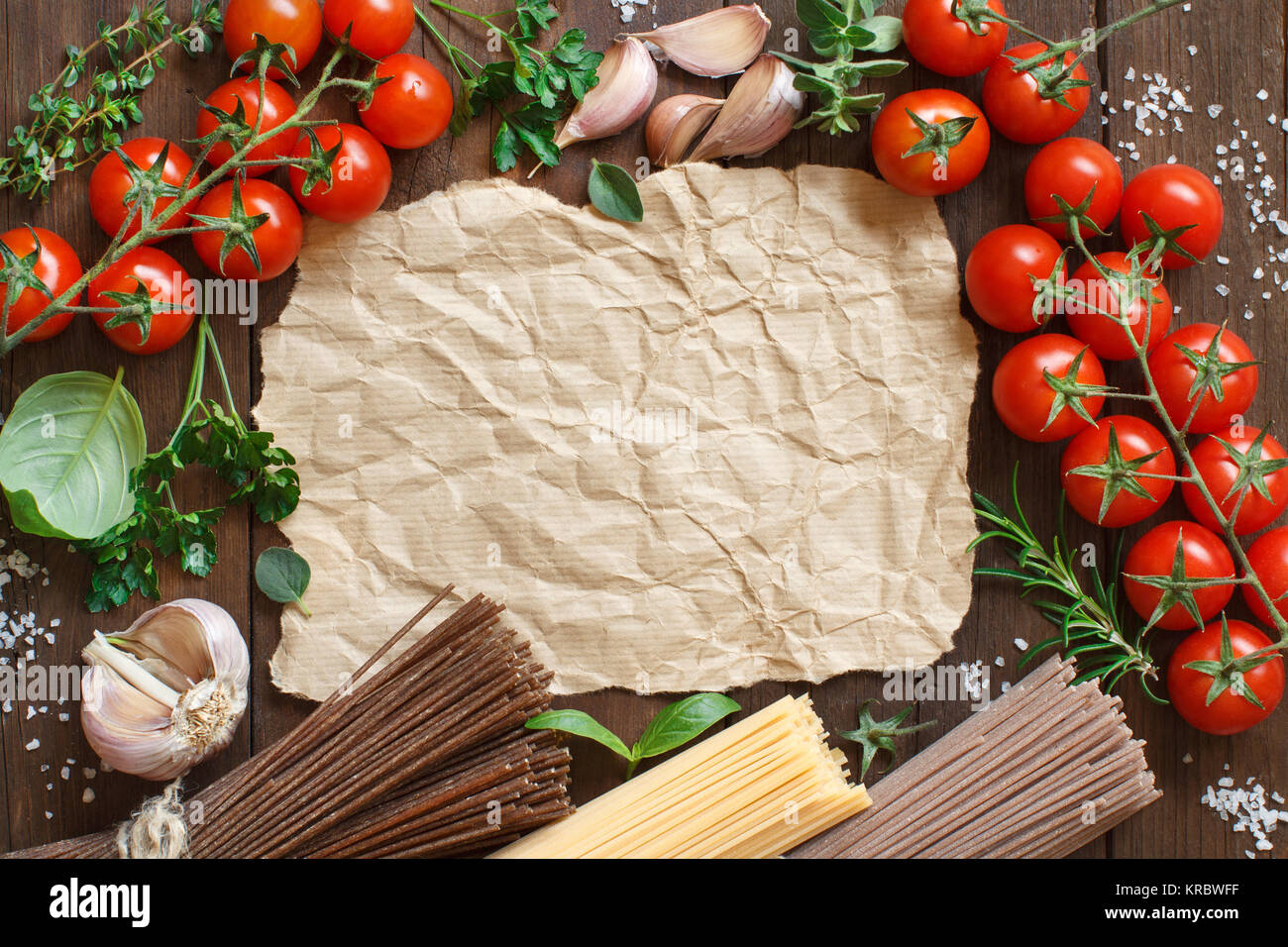 Three types of spaghetti, tomatoes and herbs Stock Photo - Alamy