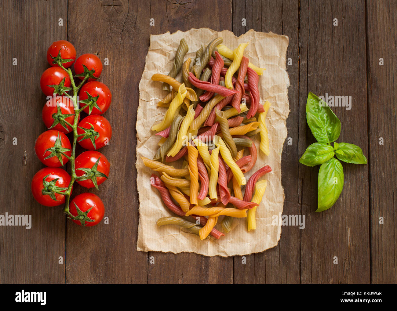 Tricolor pasta, vegetables, basil and cherry tomatoes Stock Photo - Alamy