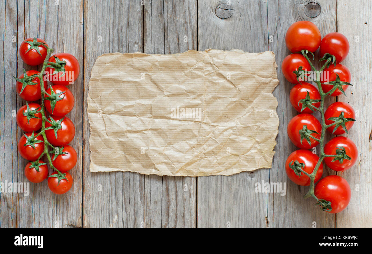 Cherry tomatoes with craft paper Stock Photo - Alamy