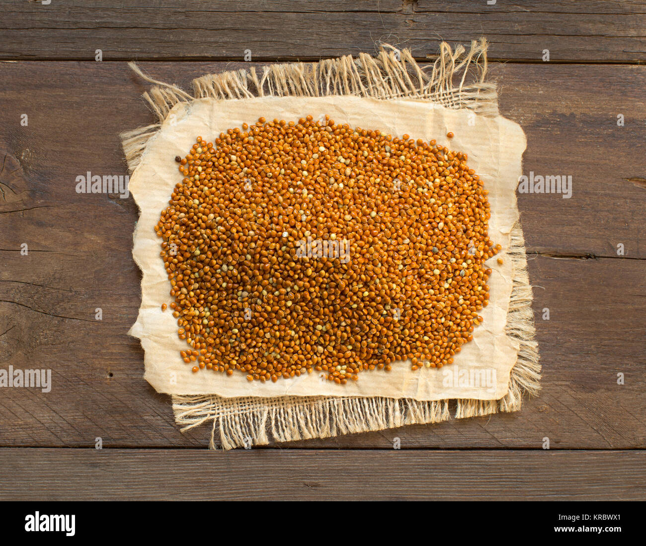 Pile of whole brown millet Stock Photo - Alamy