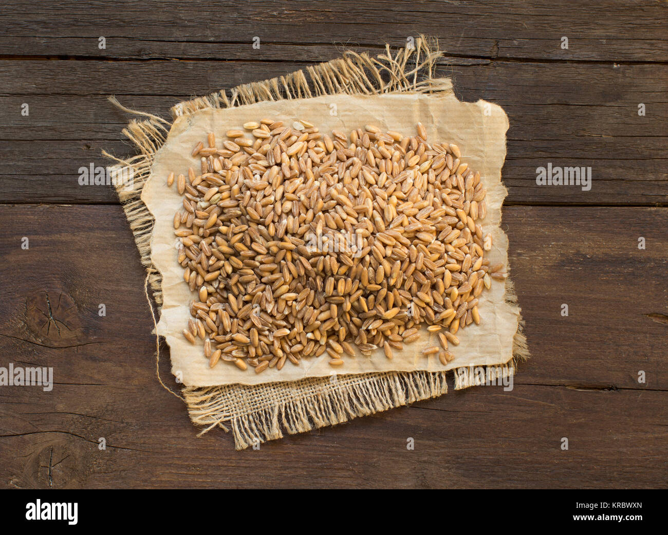 Pile of whole unpolished spelt Stock Photo - Alamy