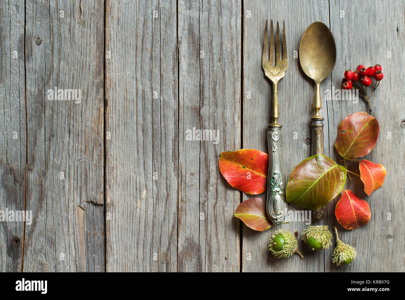 Vintage fork and knife with autumn leaves on wood Stock Photo - Alamy