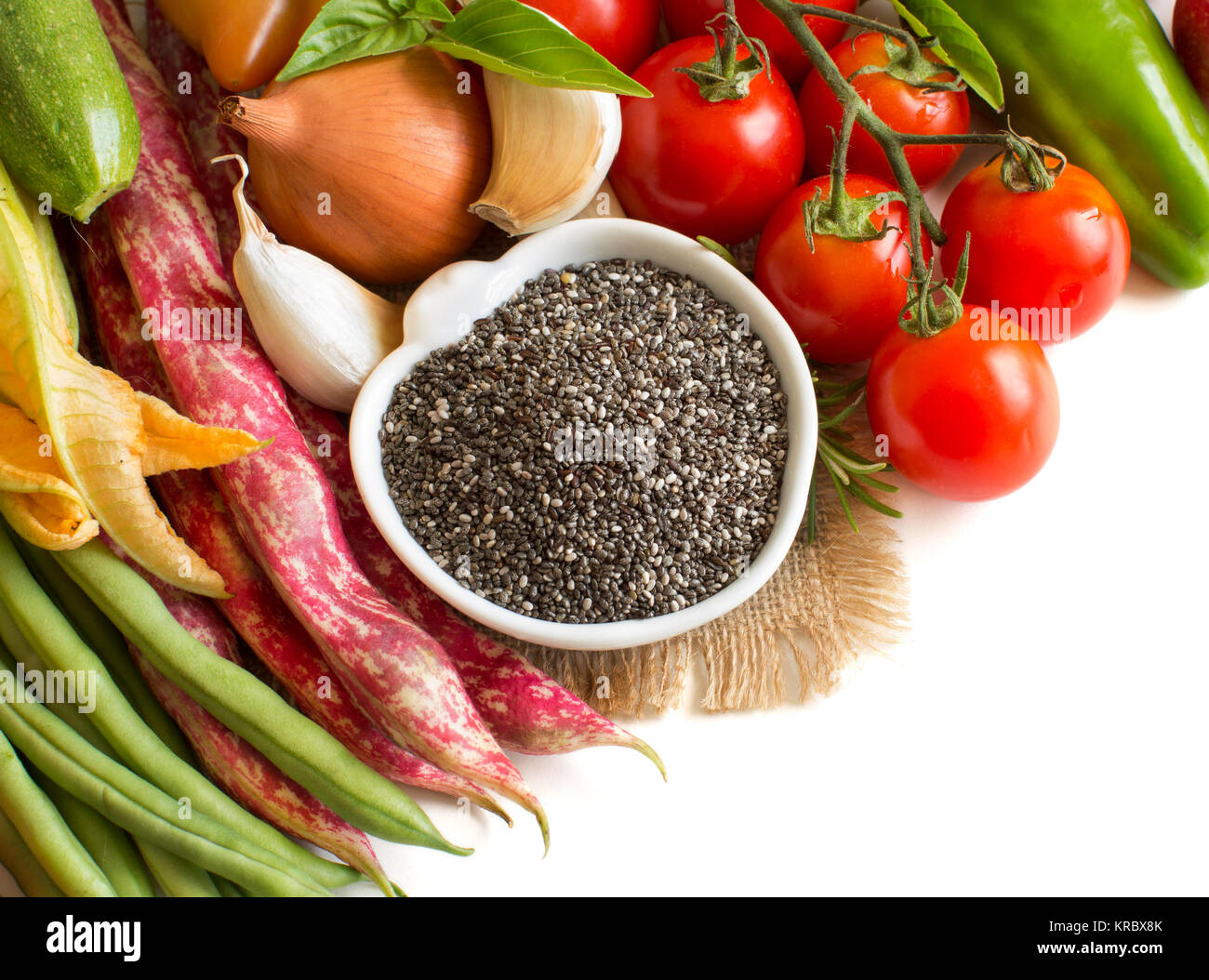 Raw chia seeds in bowl and vegetables Stock Photo - Alamy