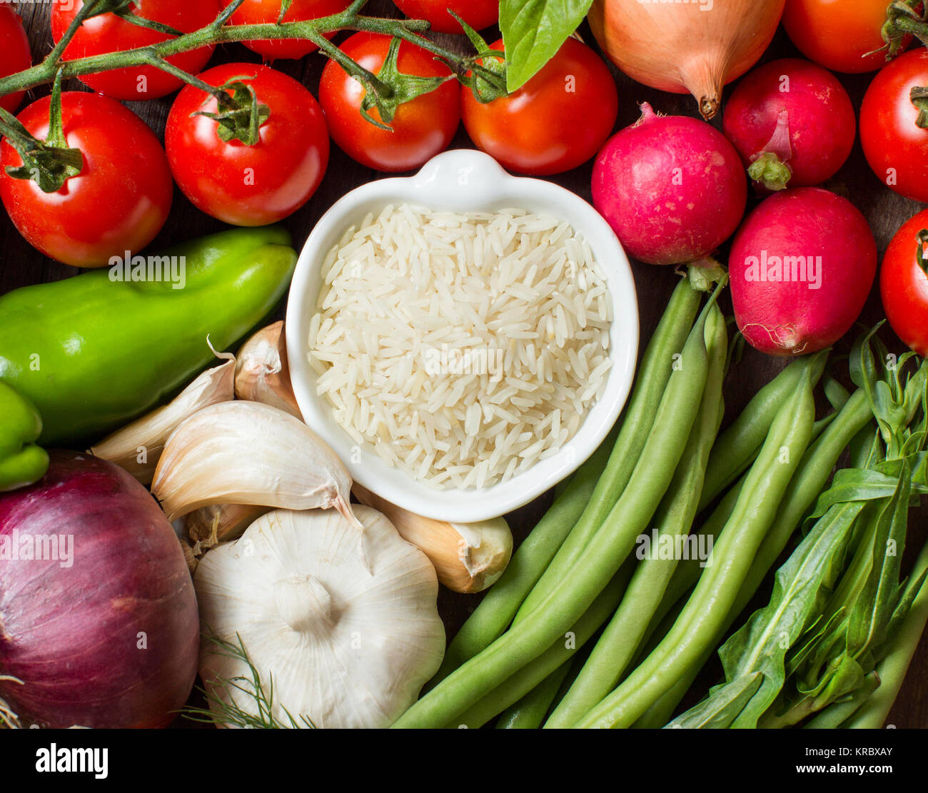 Basmati rice in bowl and fresh vegetables Stock Photo - Alamy