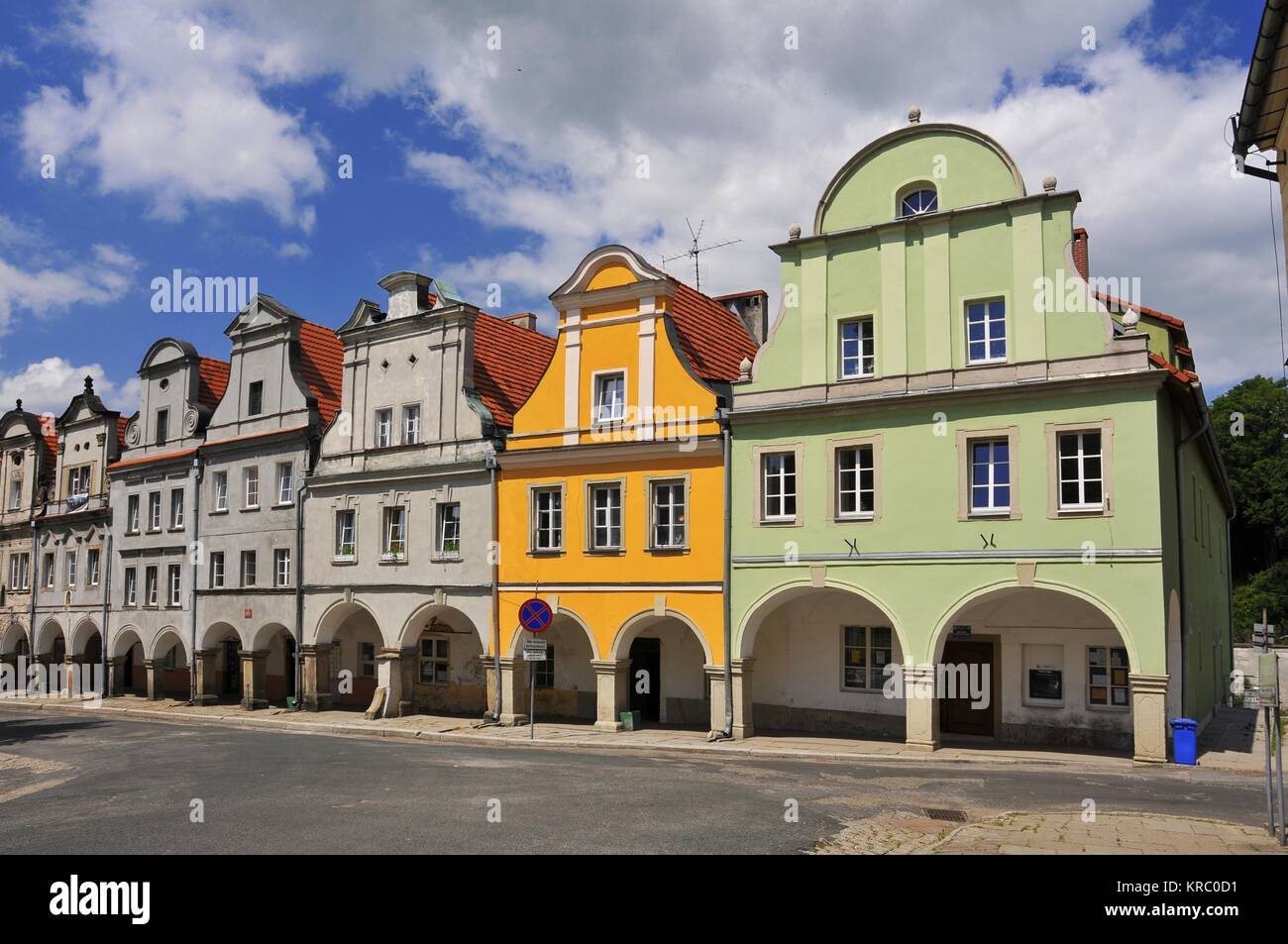 Baroque and classicist tenements at the market square in village ...