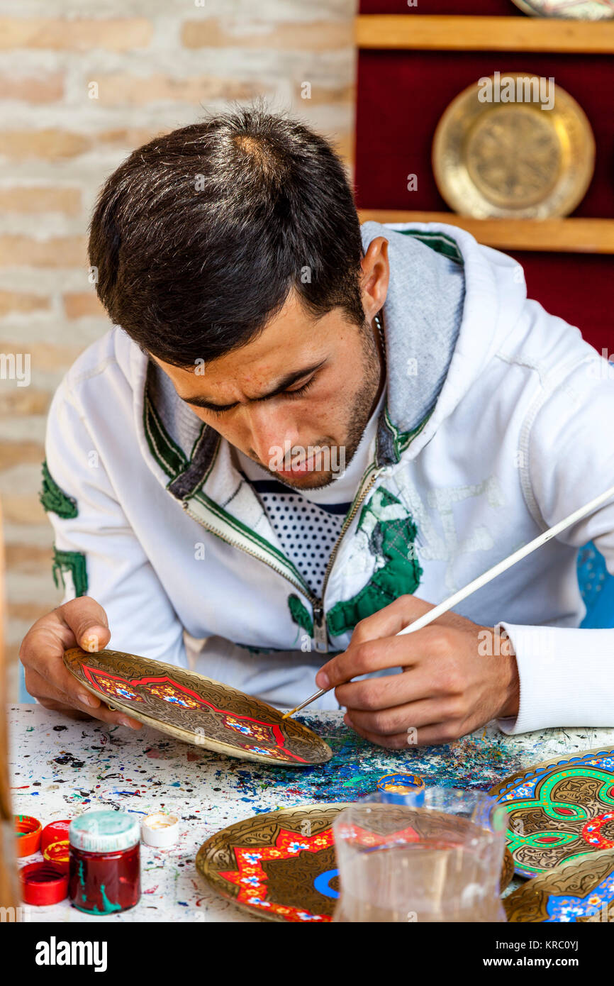 An Artist/Craftsman Working in The Market, Bukhara, Uzbekistan Stock ...