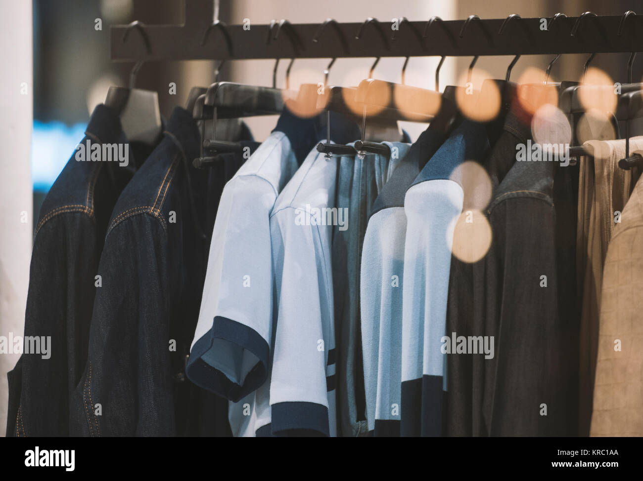 Clothing shop showcase with glass reflections in Paris Stock Photo - Alamy